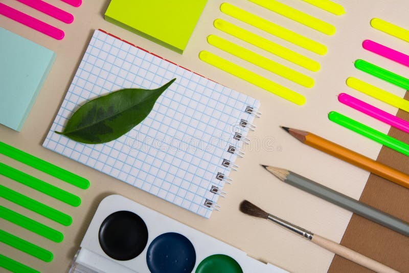 Green Leaf on a Notebook and School Supplies for Primary School Stock ...