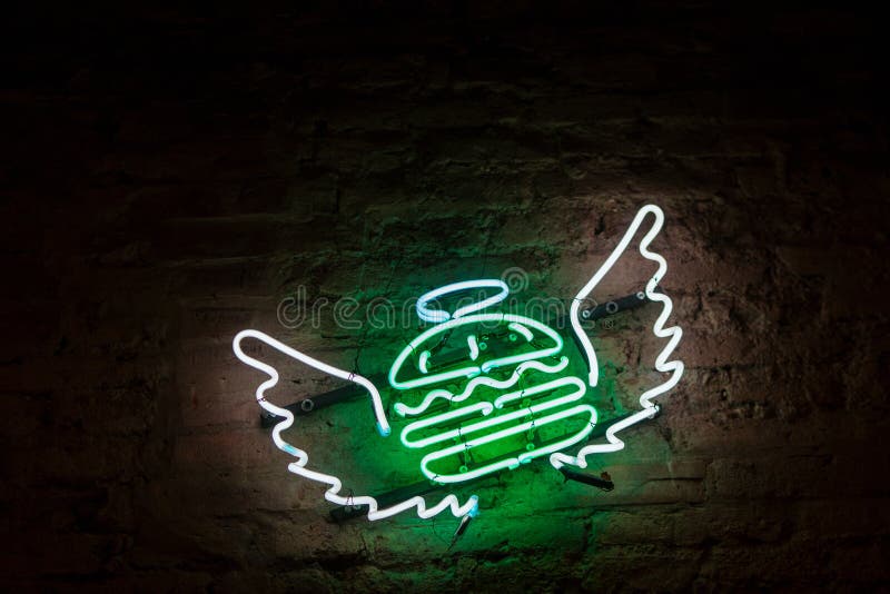 Green LED Flying Burger Sign on Brick Wall Stock Photo - Image of ...