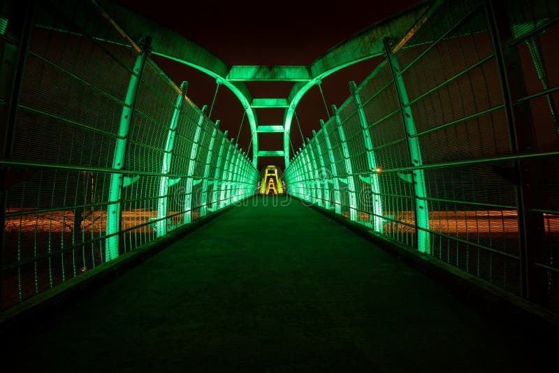 Green LEDs Illuminate Pedestrian Walkway Over Highway at Night Stock ...