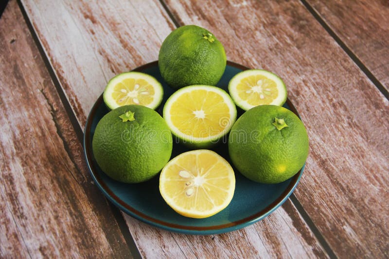 Green Lemon and Round Yellow Lemon a Slices Stock Image - Image of ...