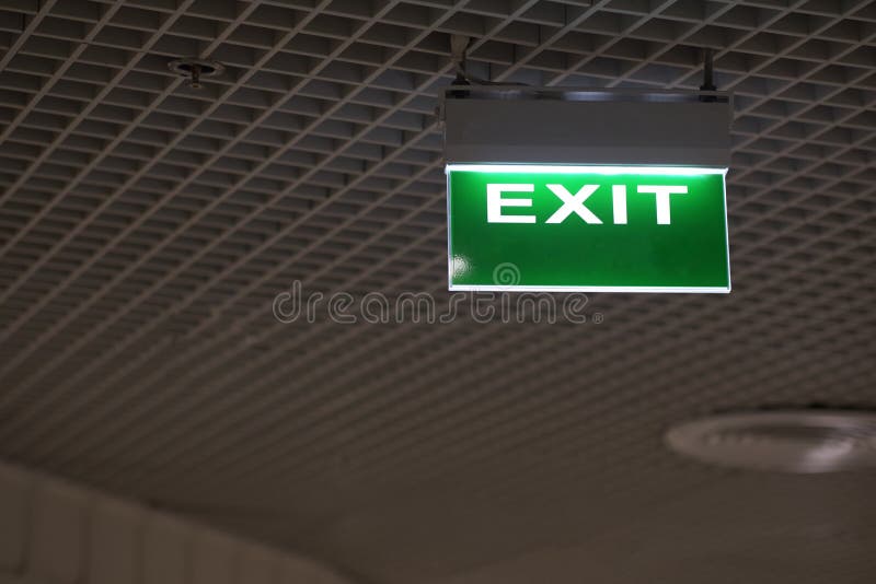 Green Light Fire Exit Sign in Office Building Stock Image - Image of ...