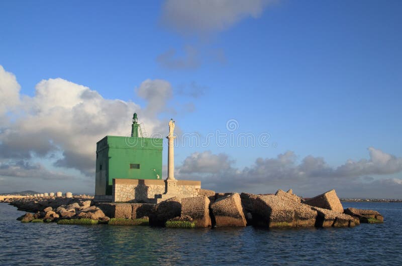 The green lighthouse stock image. Image of pier, water - 19354059