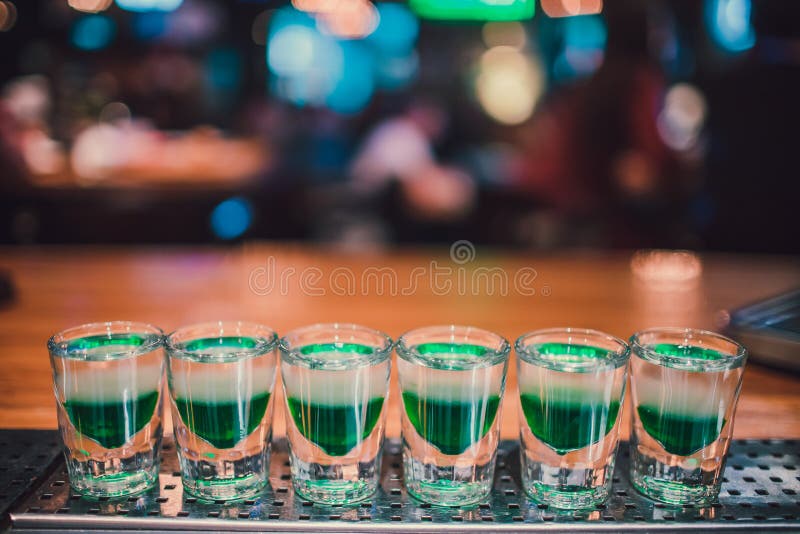 Green Liquid in Shot Glasses Standing on the Counter. Stock Image ...
