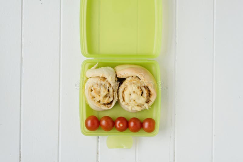 Green Lunchbox with Scrolls and Tomato Stock Image - Image of plastic ...