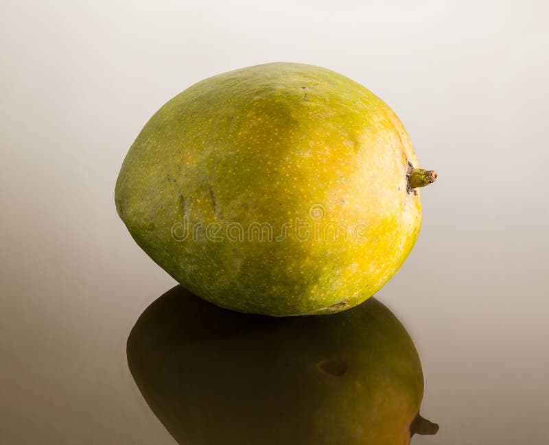 Green Mango on Mirror Like Surface Stock Photo - Image of bright ...