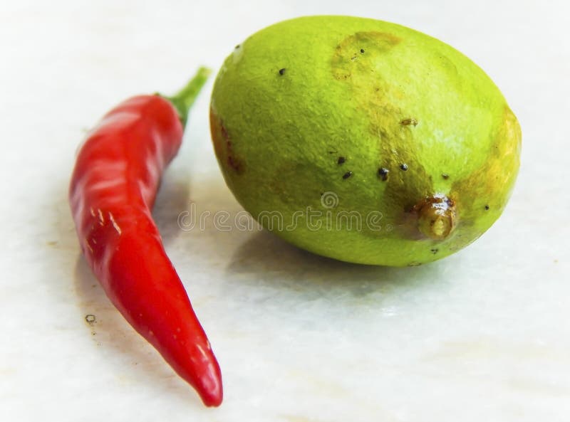 Green mango and red chilli stock photo. Image of sour - 197811424