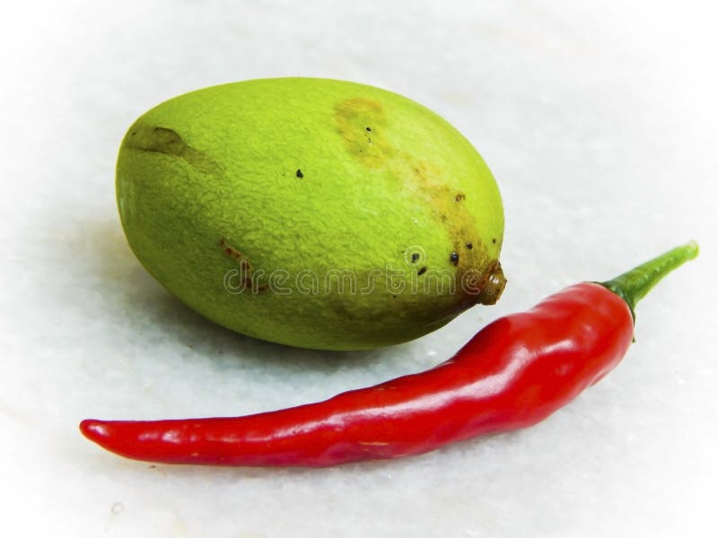 Green mango and red chilli stock image. Image of watering - 197811459