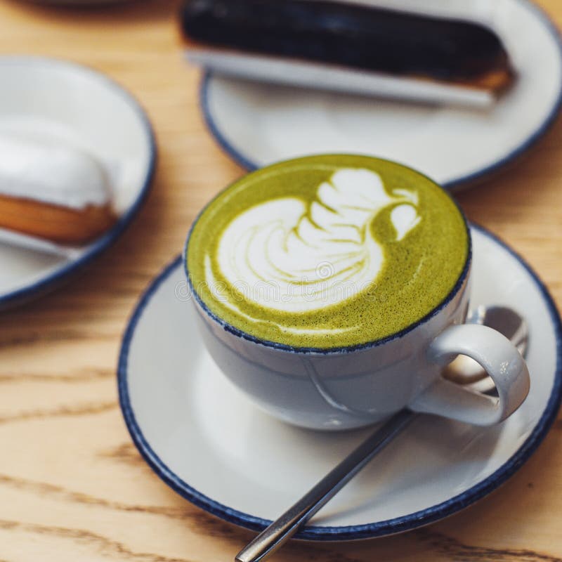 Green Matcha with a Eclair. Cozy Coffee Shop Stock Image - Image of ...