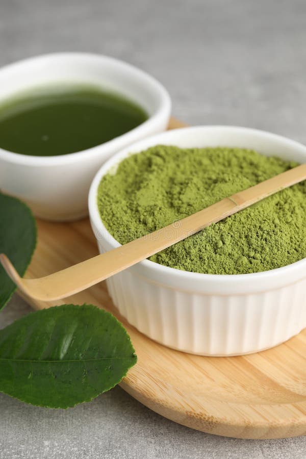 Green Matcha Powder and Bamboo Scoop on Light Grey Table, Closeup Stock ...