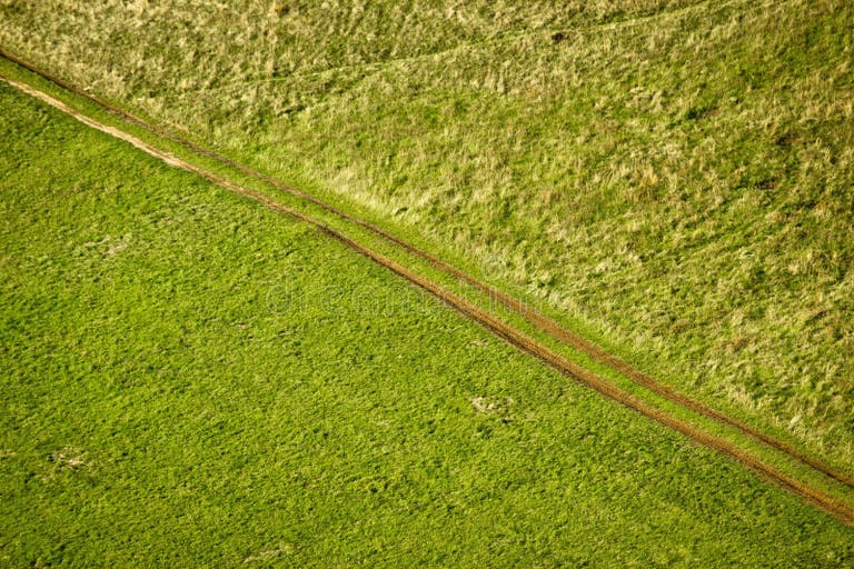 Green Meadow Diagonal Tractor Track Stock Image - Image of drive ...