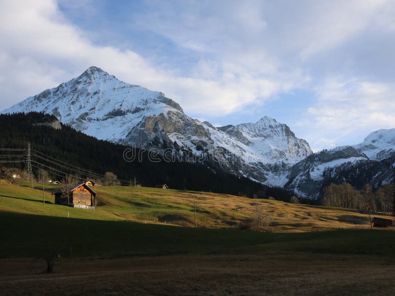 Green Meadow and Snow Covered Mountains Spitzhorn and Arpelistock Stock ...