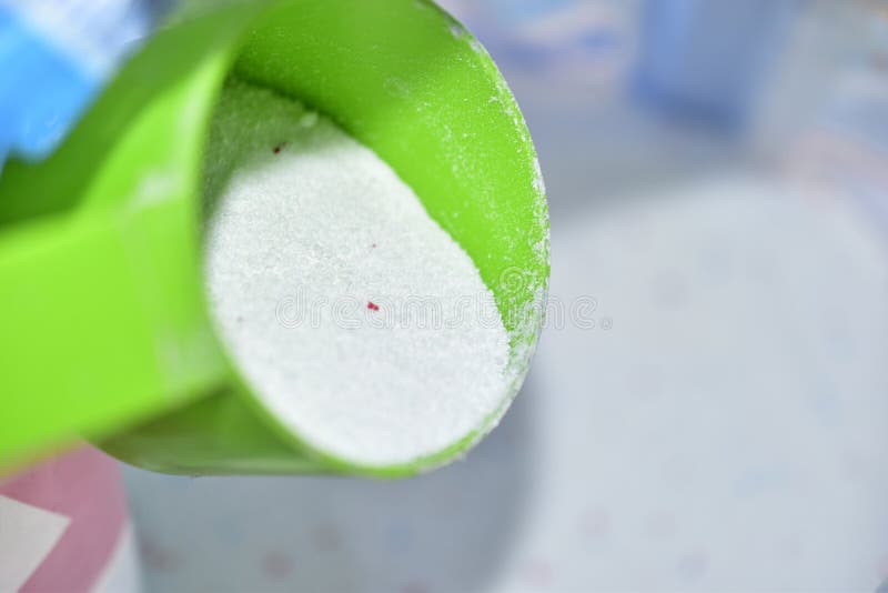 Green Measuring Cup for Washing Powder and Water Stock Image - Image of ...