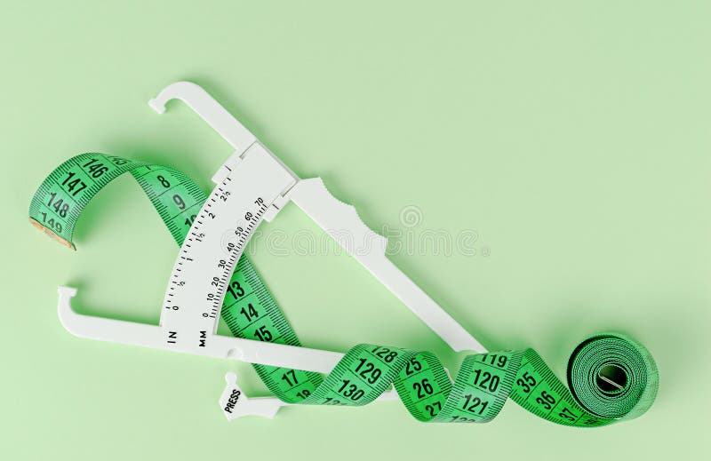 Green Measuring Tape and White Caliper. Stock Image - Image of diet ...