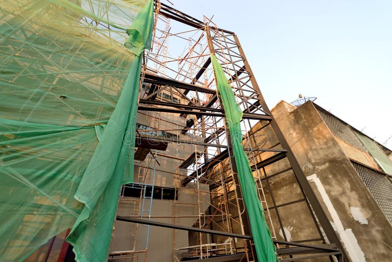 Green Mesh Construction stock image. Image of construction - 84856675
