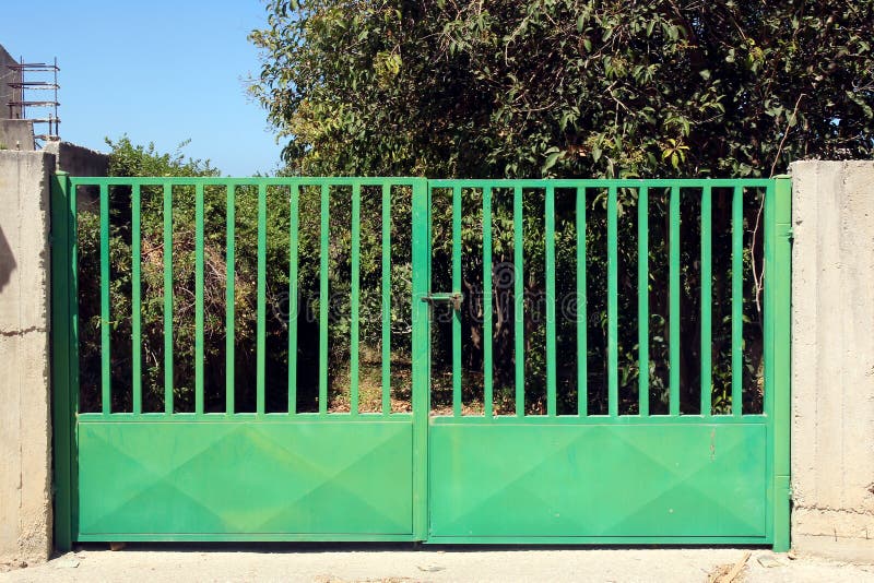 Green metal gate stock photo. Image of community, wall - 34703192