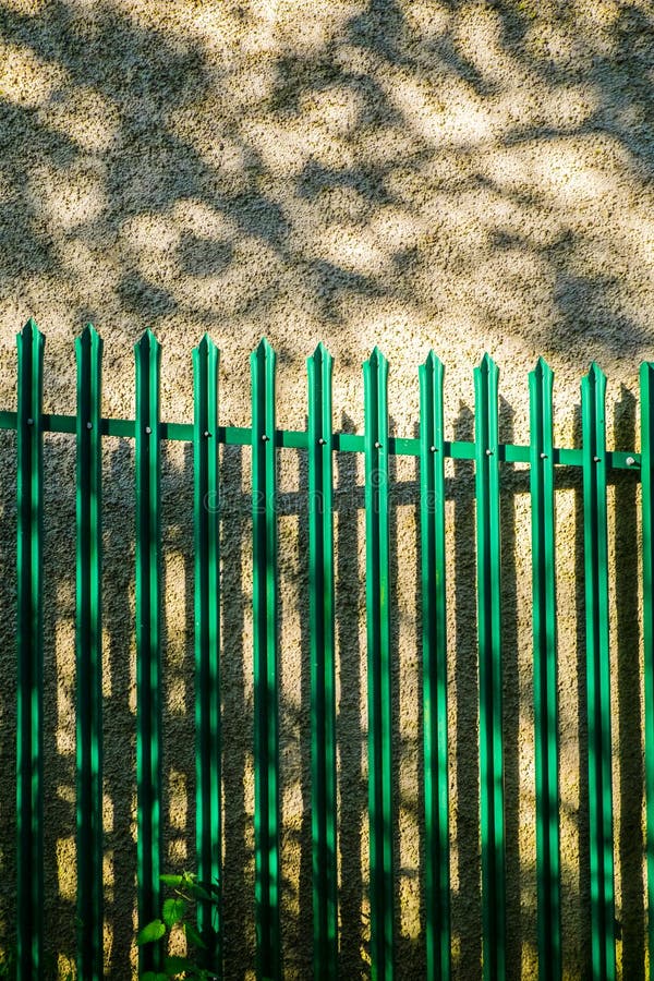 Green Metal Railings and and Tree Shadow on Wall Stock Image - Image of ...