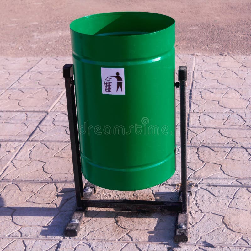 Green Metal Tipping Trash Can. Stock Image - Image of plastic, yellow ...
