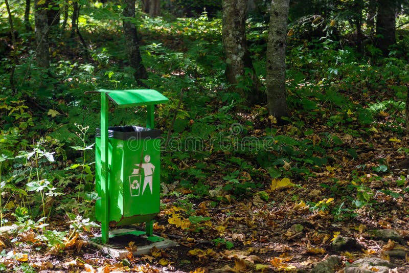 Green Metal Trash Can in the Park or Forest Stock Image - Image of ...