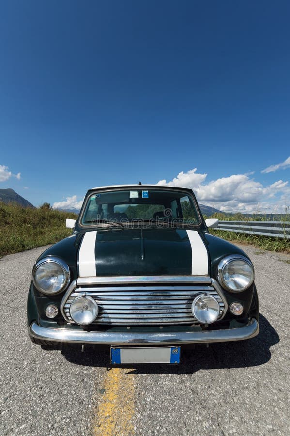 Green Mini Cooper with a Blue Sky Stock Image - Image of popular ...