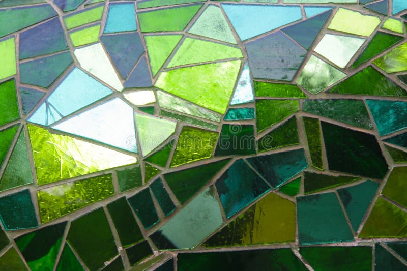 A Green Mosaic Wall with Irregular Geometric Glass Tiles, Creating a ...