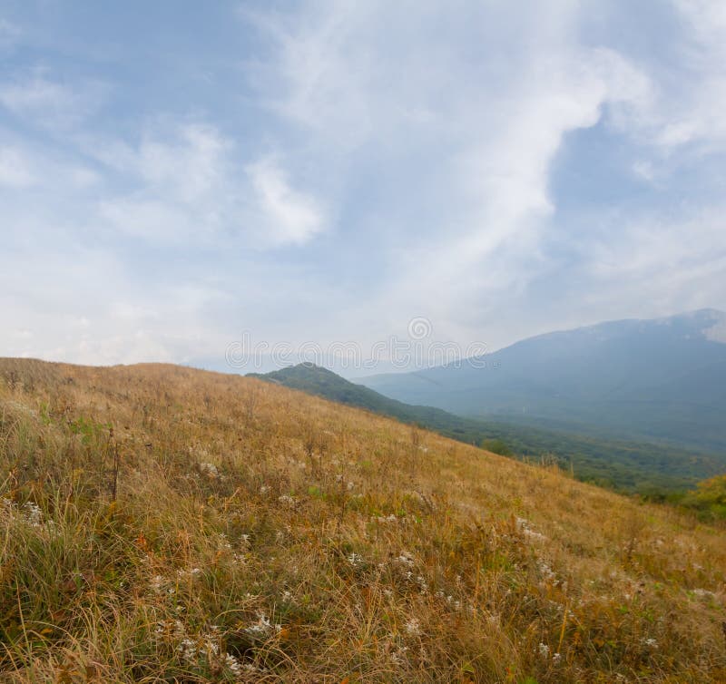 Mount slope in dry grass stock photo. Image of valley - 241812310