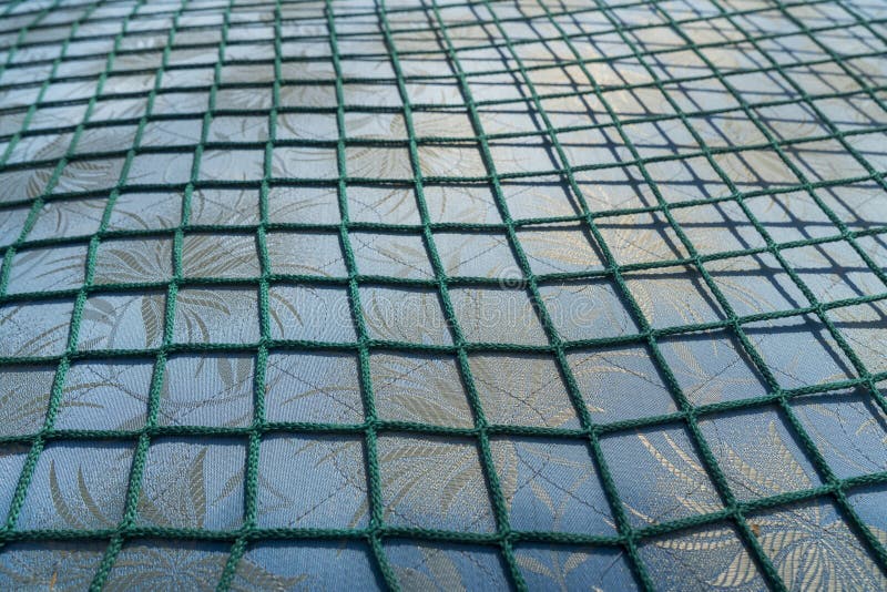 Green Net Over a Fabric Pattern Stock Photo - Image of fabric, texture ...