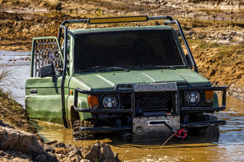 Green Off-road Car, Vehicle Buried in Deep Mud, Off-road Stock Photo ...