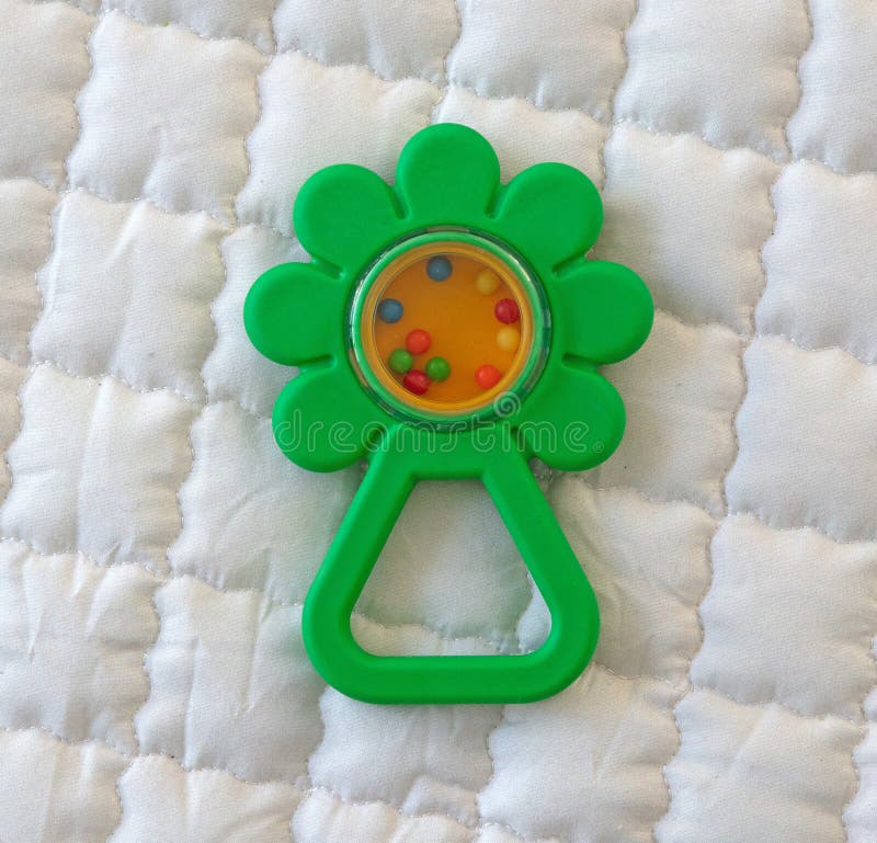 Green Old Baby Rattle with Balls Stock Photo - Image of rattle, girl ...