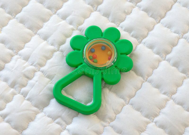 Green Old Baby Rattle with Balls Stock Photo - Image of rattle, girl ...