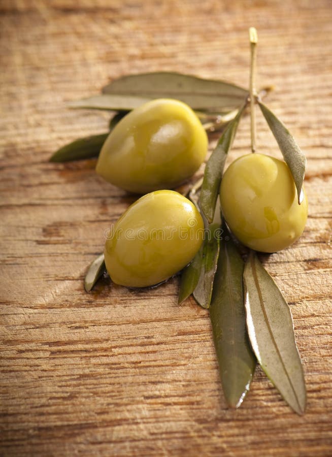 Three olives on olive oil stock image. Image of aromatic - 12680513
