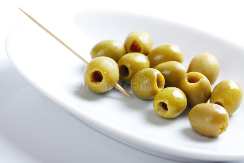 Green olives and toothpick stock photo. Image of gourmet - 13056038
