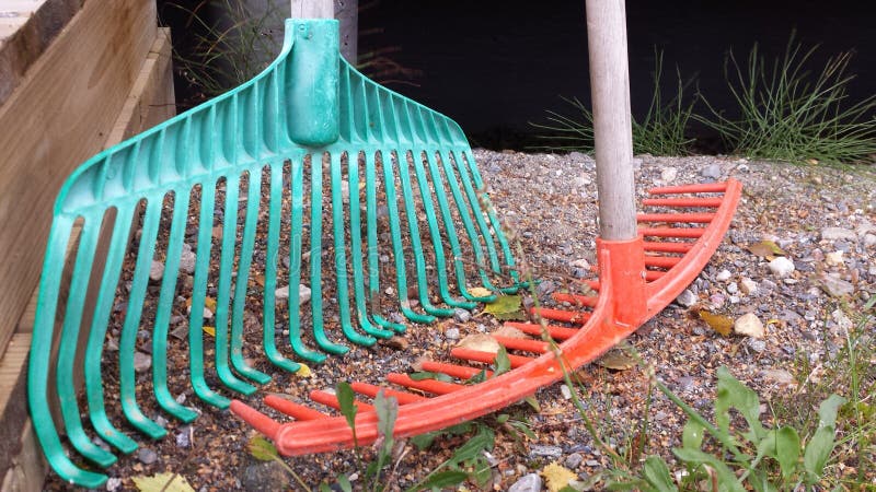 Green and orange rake stock photo. Image of shape, green - 99054612