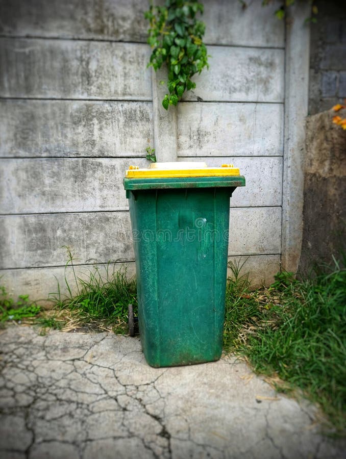 Green outdoor trash can stock image. Image of green - 385371383