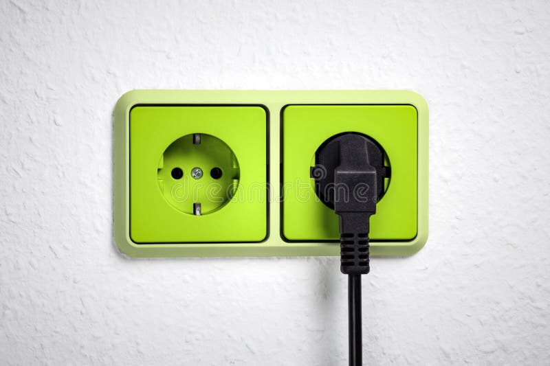 Green Outlet with a Plug on a Wall Stock Image - Image of home ...