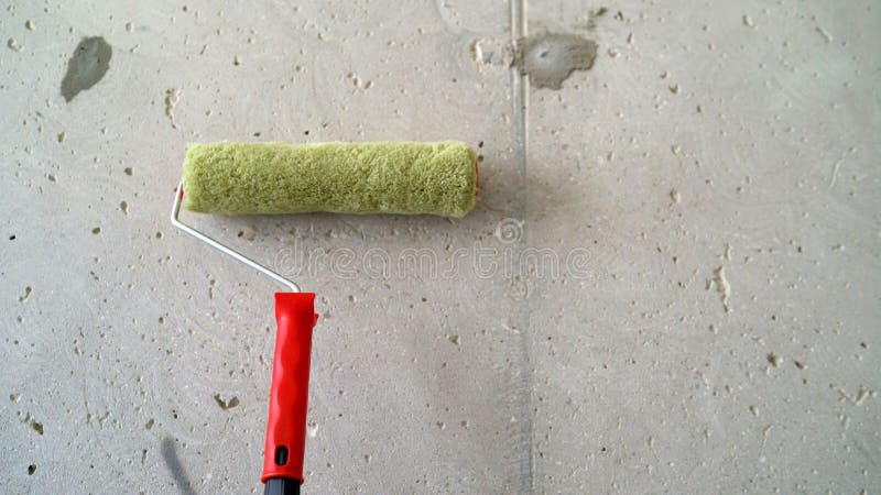 Paint Roller Lying on Concrete Surface Ready for Priming or Painting ...
