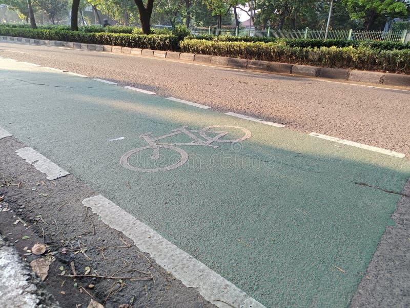 A Green Painted Bicycle Lane on the Road Surface. Stock Photo - Image ...