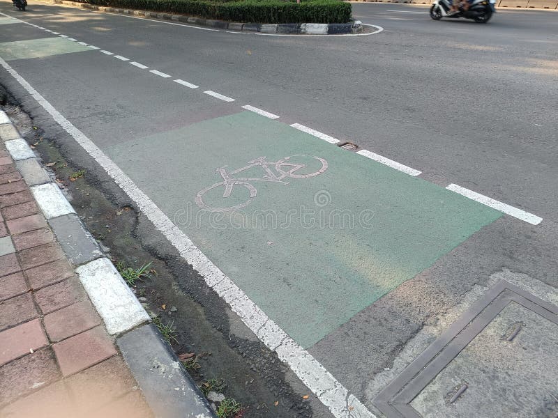 A Green Painted Bicycle Lane on the Road Surface. Stock Photo - Image ...