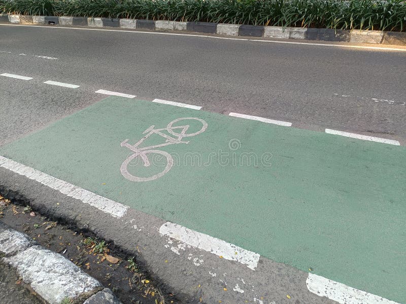A Green Painted Bicycle Lane on the Road Surface. Stock Photo - Image ...