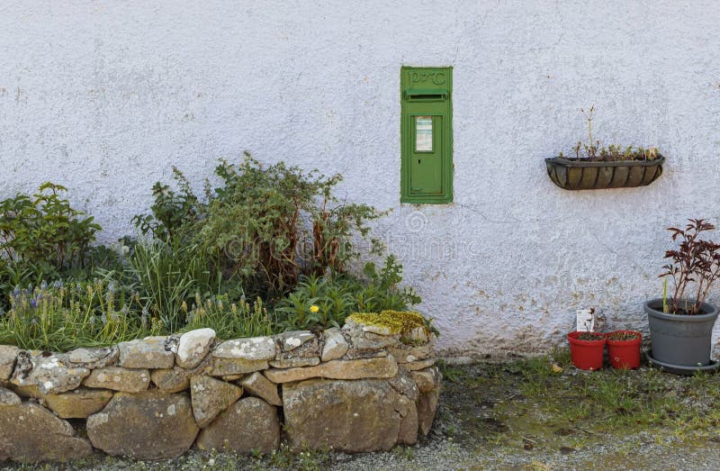 Green Painted Irish Post Box in a White Painted Wall Stock Image ...