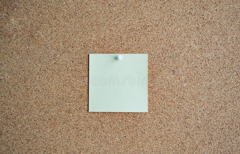 A Green Paper Note on a Cork Board, Attached with a White Pushpin. Copy ...
