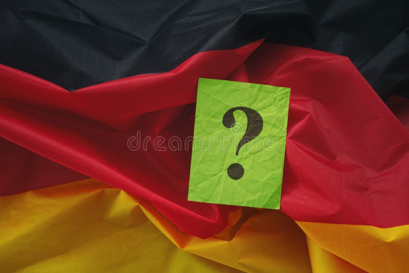 A Green Paper Note with a Question Mark on it Lying on the German Flag ...