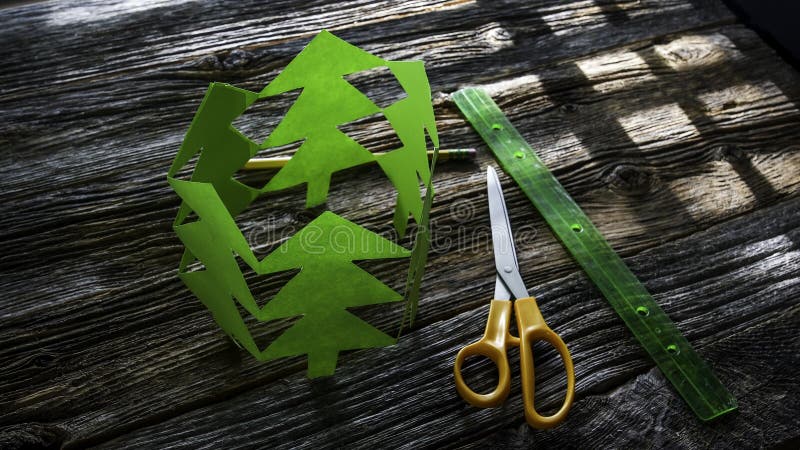 Green Paper Trees Decoration with Project Tools on Rustic Table Stock ...