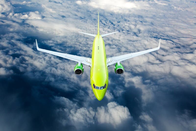 Green Passenger Plane Fly Over the Clouds. Front View. Stock Image ...