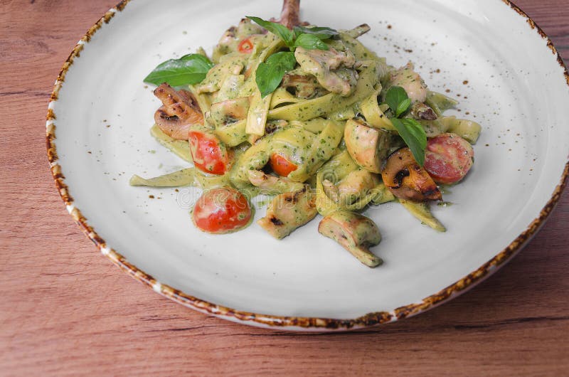 Green Pasta with Chicken, Basil and Mushrooms Stock Photo - Image of ...