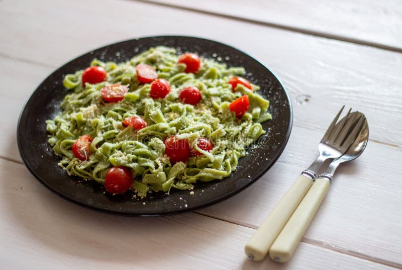 Green Pasta with Tomatoes and Parmesan Cheese. Stock Photo - Image of ...