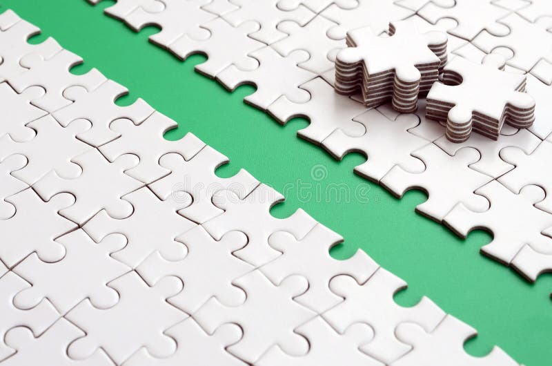 The Green Path is Laid on the Platform of a White Folded Jigsaw Puzzle ...
