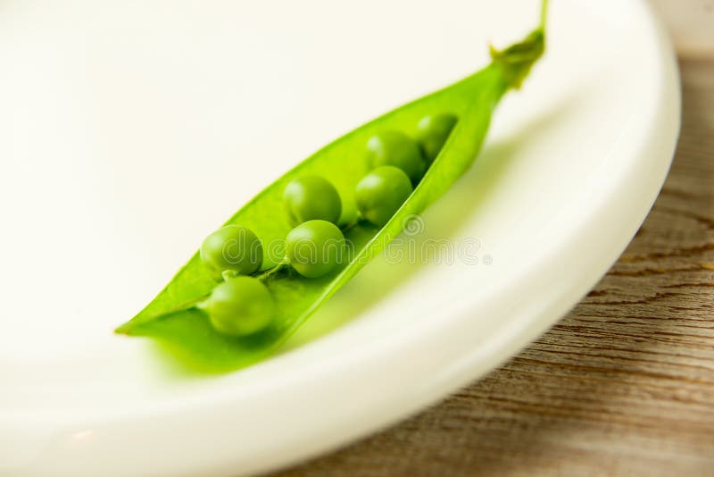 Green Pea Pod on the White Plate. Stock Image - Image of eating, bullet ...