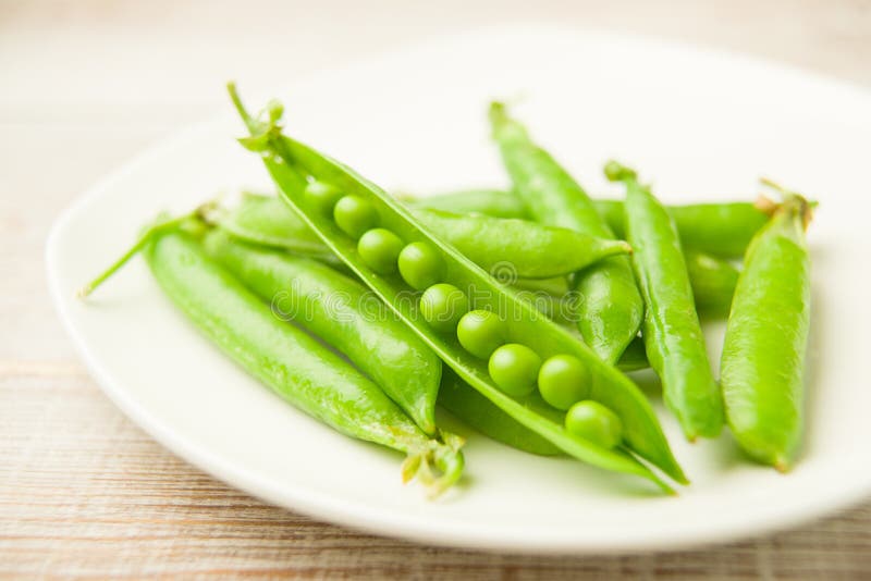 Green Pea Pods on the Big White Plate. Stock Image - Image of feeding ...