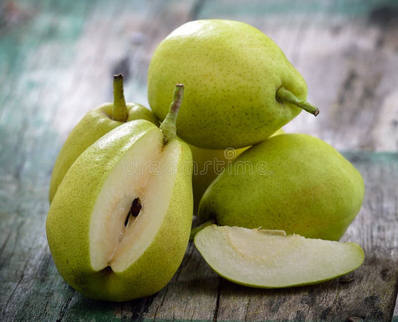 Green Pears on Rustic Wooden Stock Photo - Image of freshness, green ...