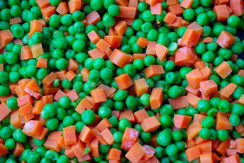 Green Peas and Cubes of Orange Carrot. Mixed Vegetable Stock Image ...